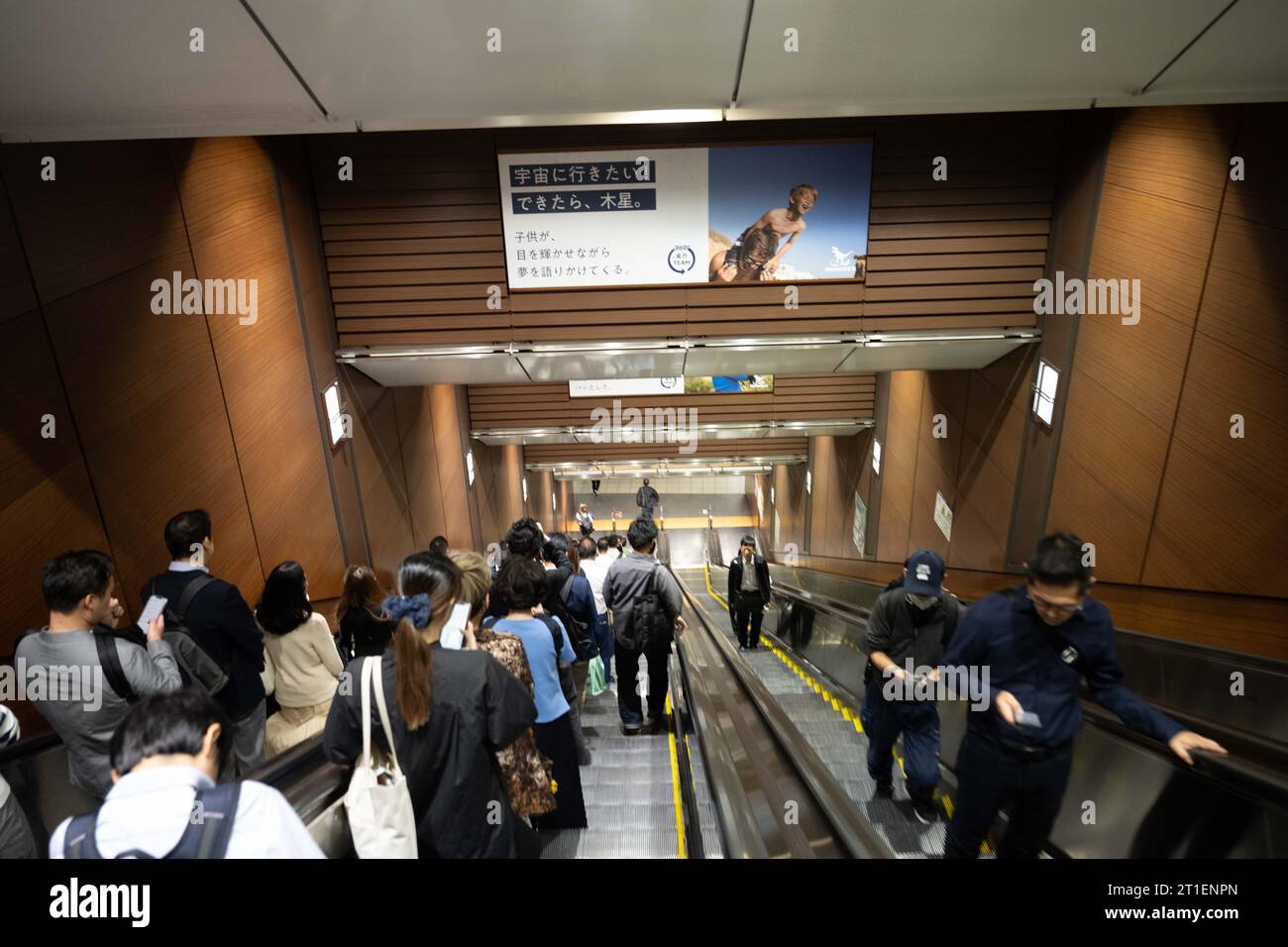 Tokyo, Japan. 13th Oct, 2023. Tokyoite commuters line the escalators at ...