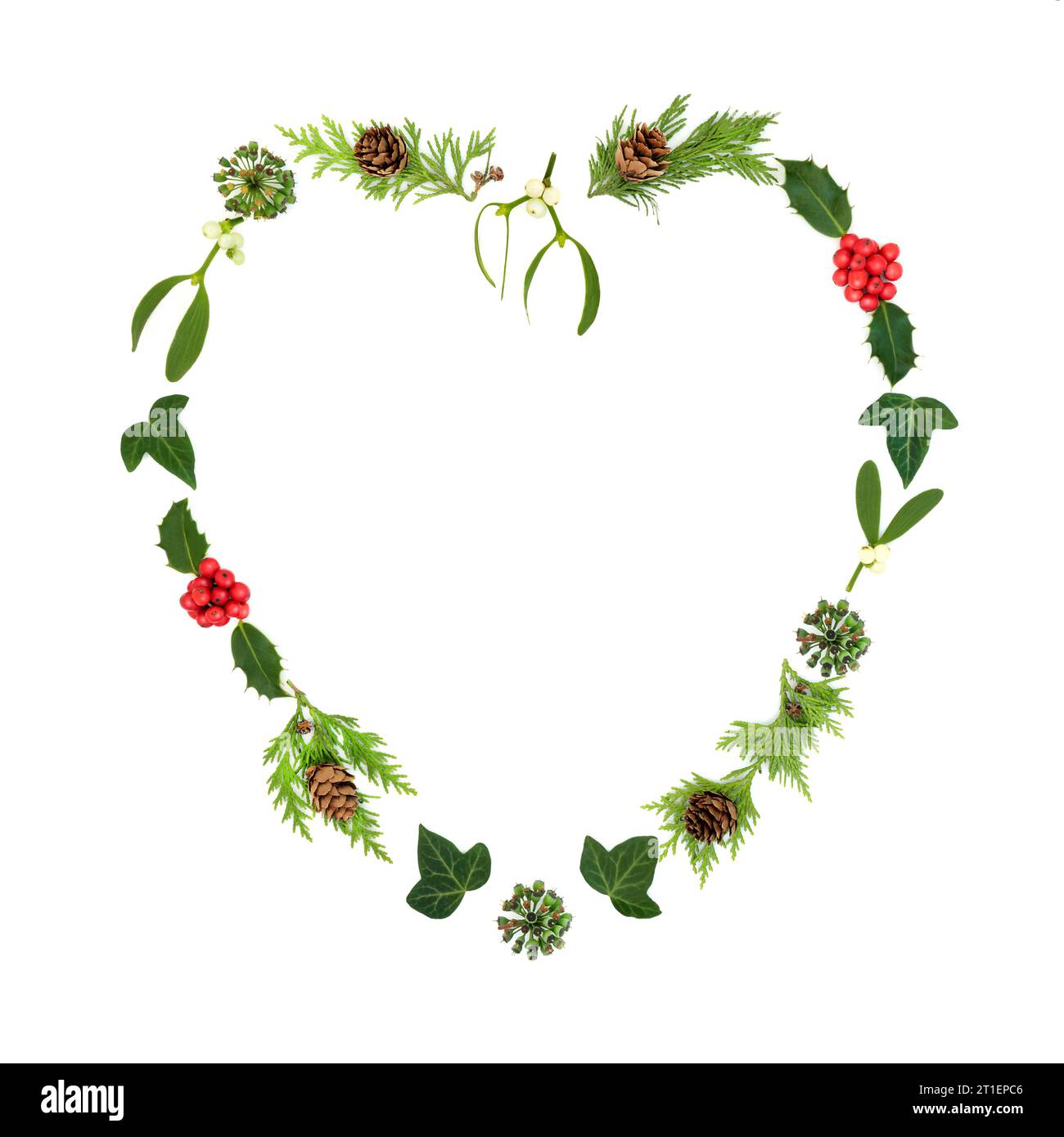 Christmas heart shape wreath with holly, mistletoe and traditional ...