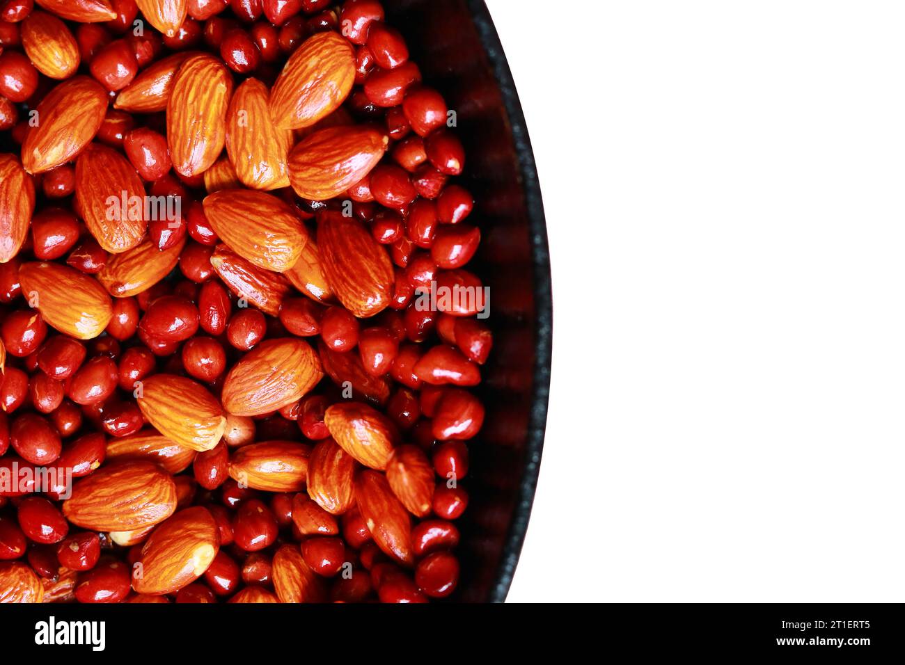 Dried Almonds in a bowl isolated on a white background Stock Photo - Alamy