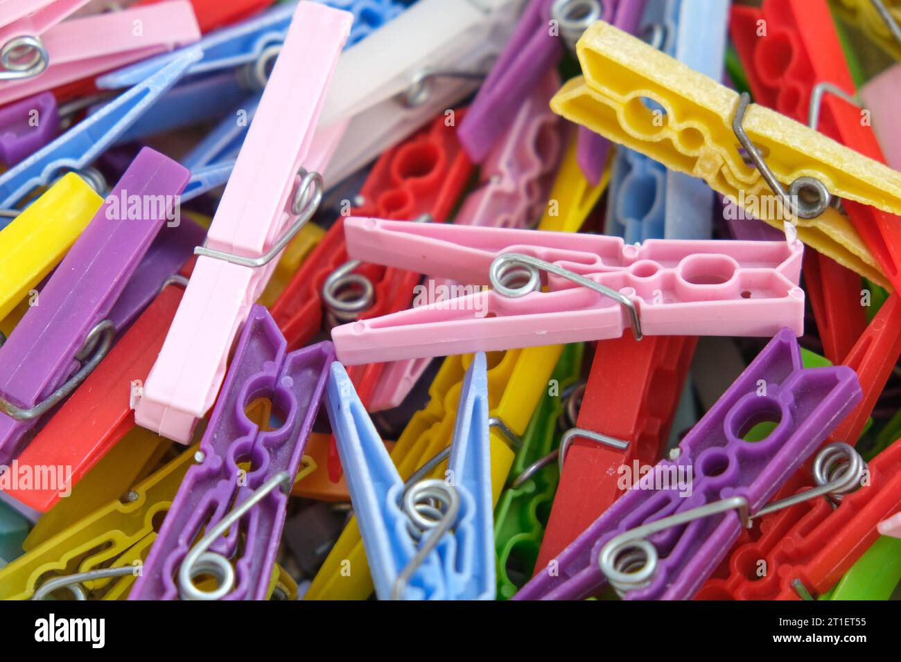 Close up plastic colorful heap of clothespin Stock Photo - Alamy