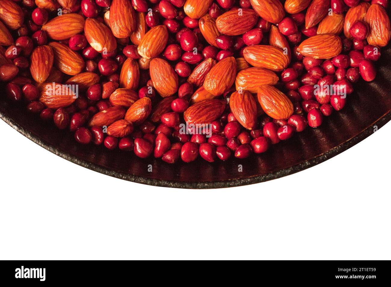 Dried Almonds in a bowl isolated on a white background Stock Photo - Alamy