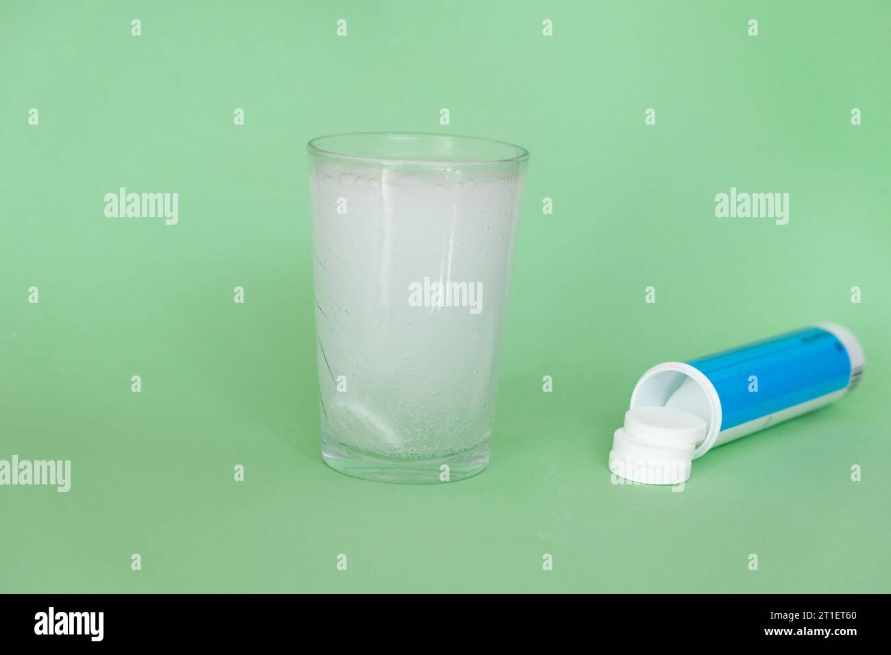 Water soluble C vitamin inside water with green background. Medical ...