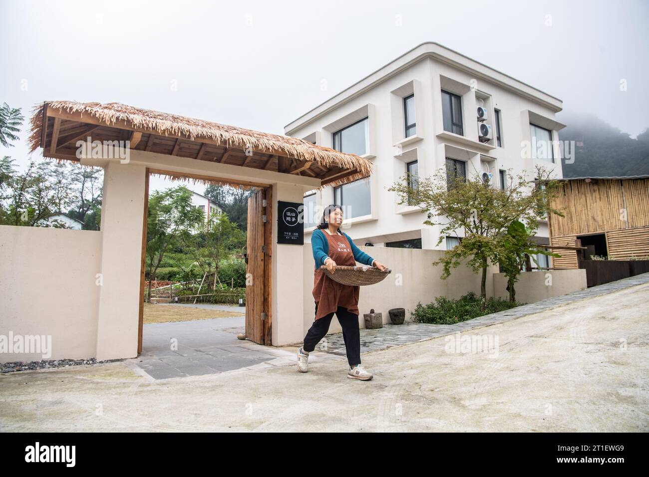 (231013) -- CHONGQING, Oct. 13, 2023 (Xinhua) -- A villager is seen at ...