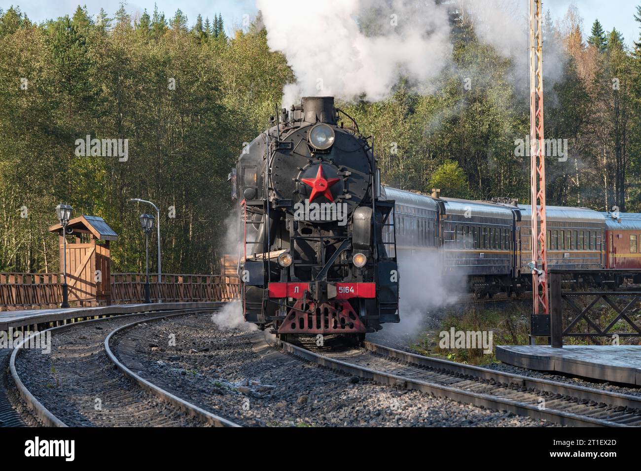 RUSKEALA, RUSSIA - OCTOBER 06, 2023: Steam locomotive L-5164 with retro train "Ruskeala Express ...