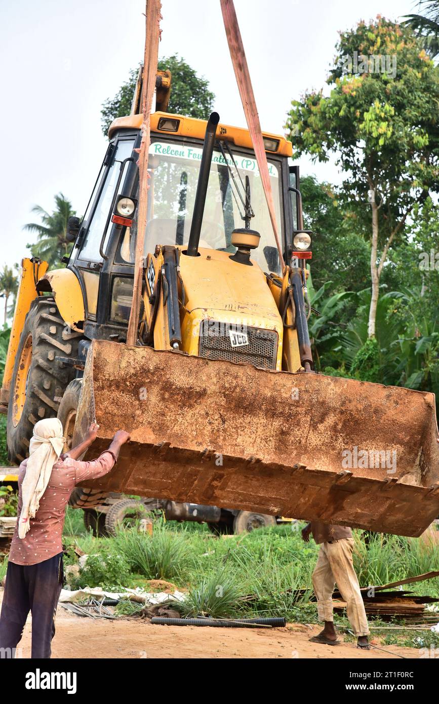 lifting jcb using a crane Stock Photo - Alamy