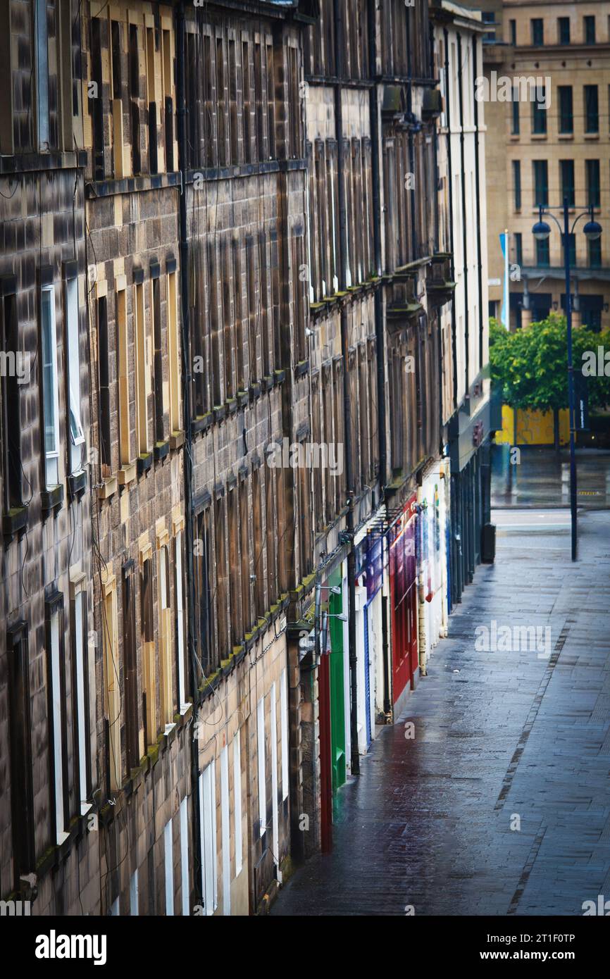 A deserted street in Edinburgh Scotland with ancient terraced houses ...