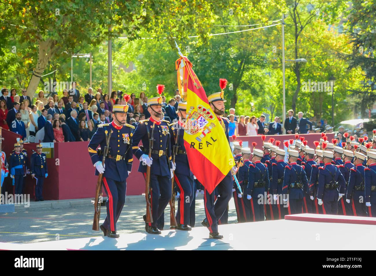Royal Guard holding the Spanish flag standard . Some 4,100 military personnel participated ...
