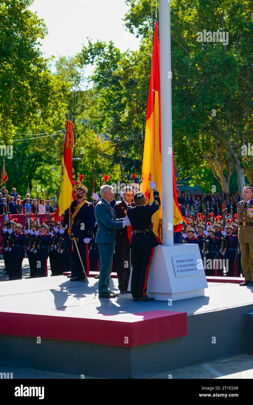 The raise the Spanish flag . Some 4,100 military personnel participated during the National Day ...