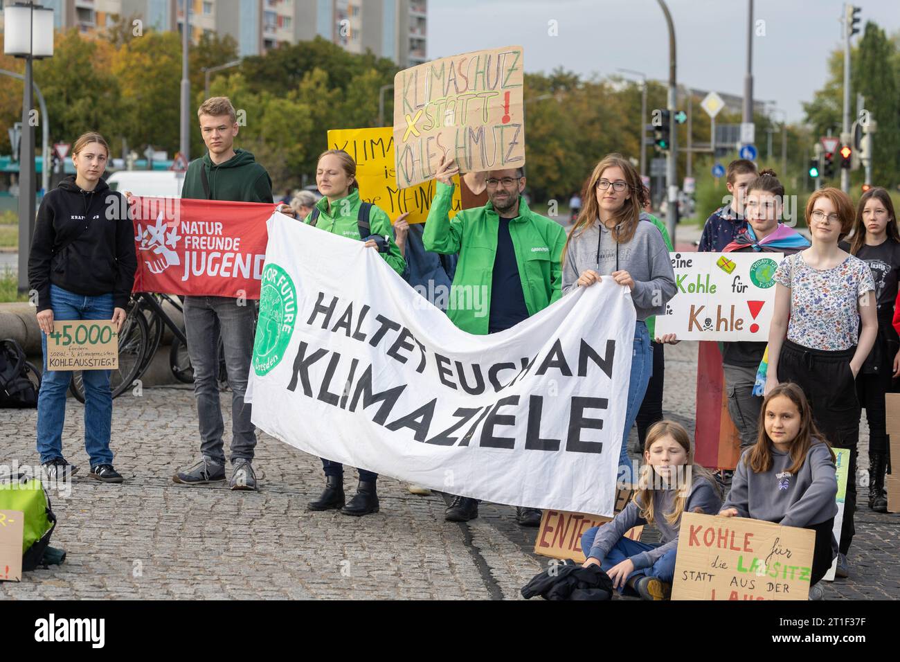 Dresden, Germany. 13th Oct, 2023. Several young people stand in front of the Saxon State ...