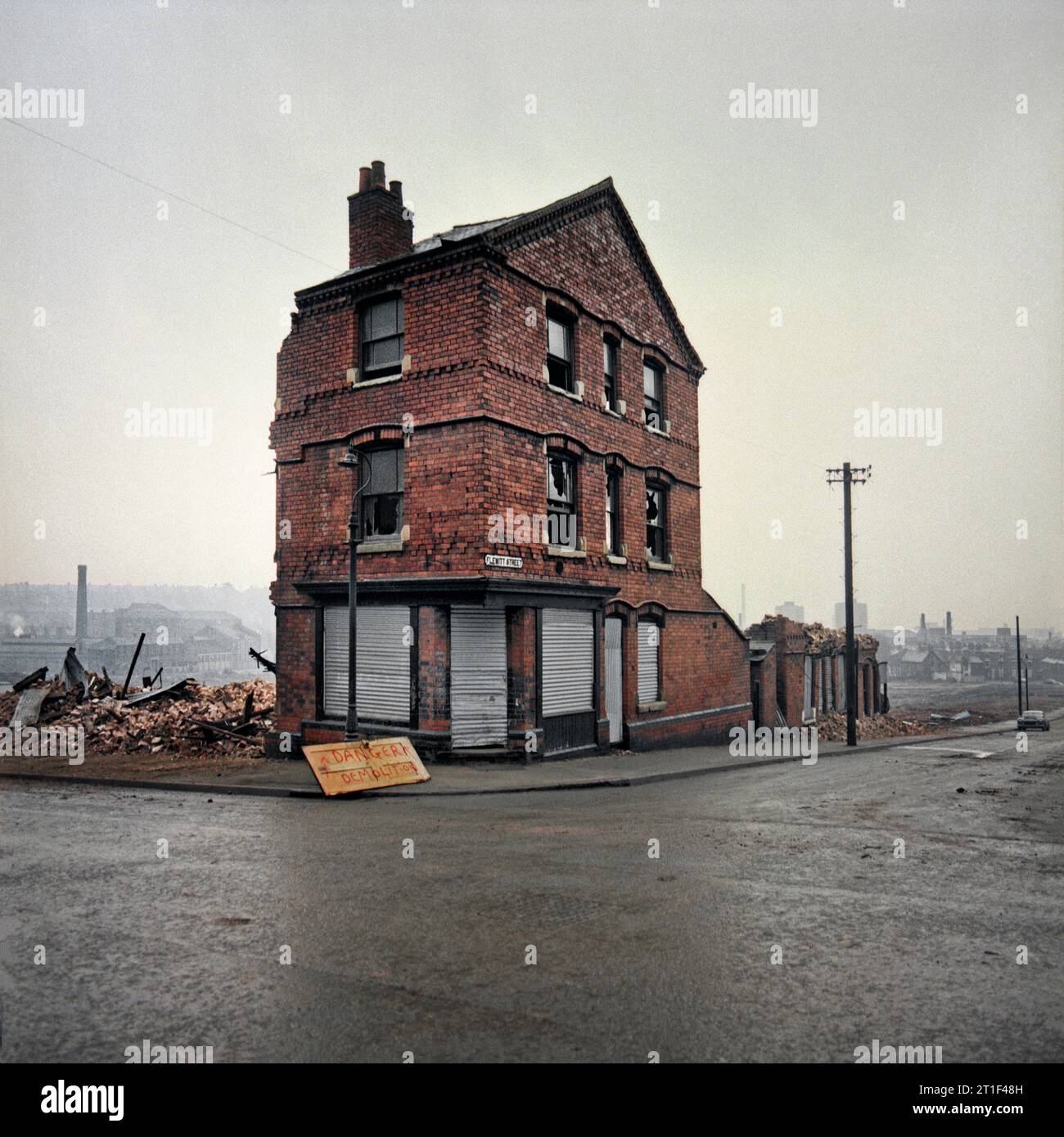 Isolated corner shop awaiting demolition, amongst streets of demolished ...