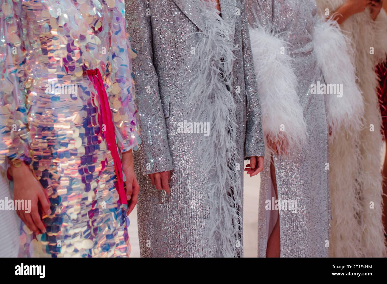 Silhouettes of fashion models on backstage dressed in a long Haute ...