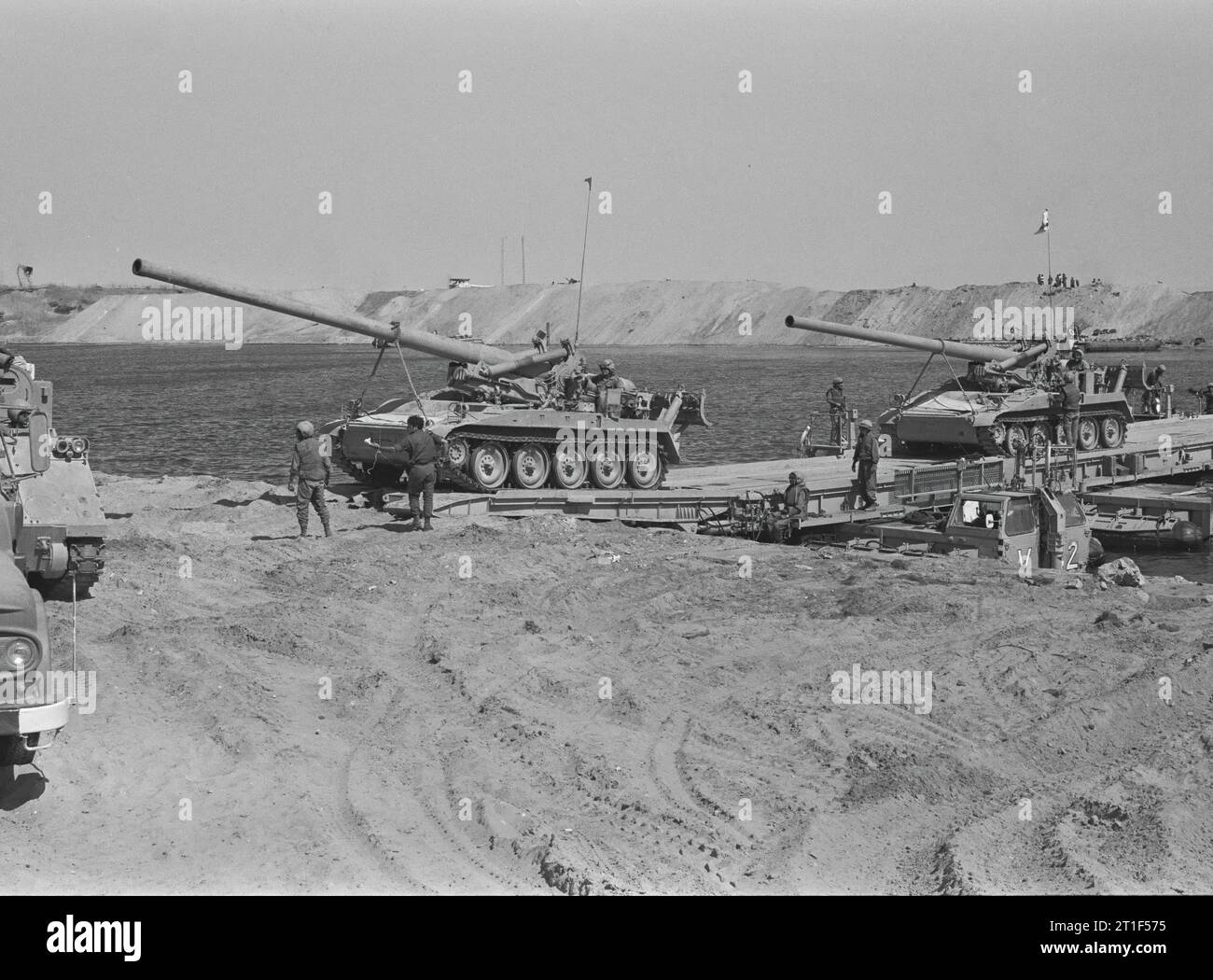 YOM KIPPUR WAR. IN THE PHOTO, TANKS CROSSING A MOBILE BRIDGE BUILT BY ...