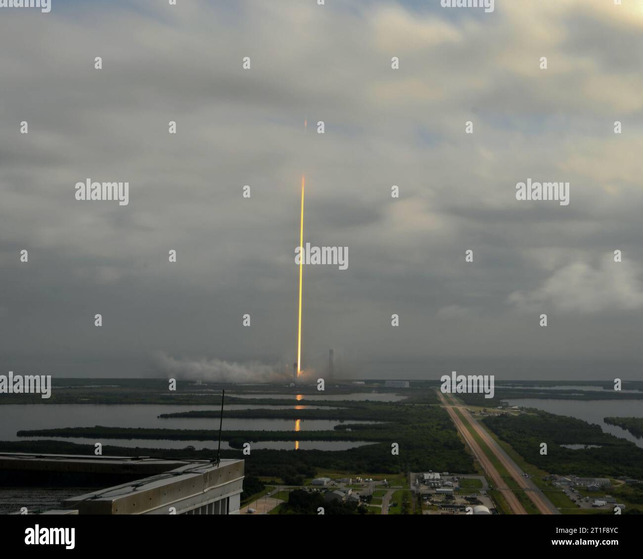 A timed exposure shows the SpaceX Falcon Heavy rocket launching into a ...