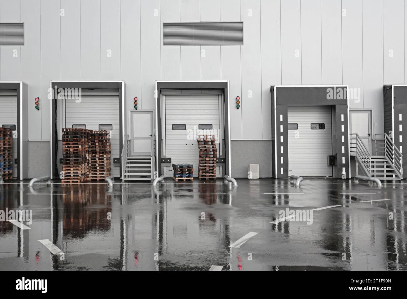Wooden Pallets in Front of Warehouse Loading Dock Stock Photo - Alamy