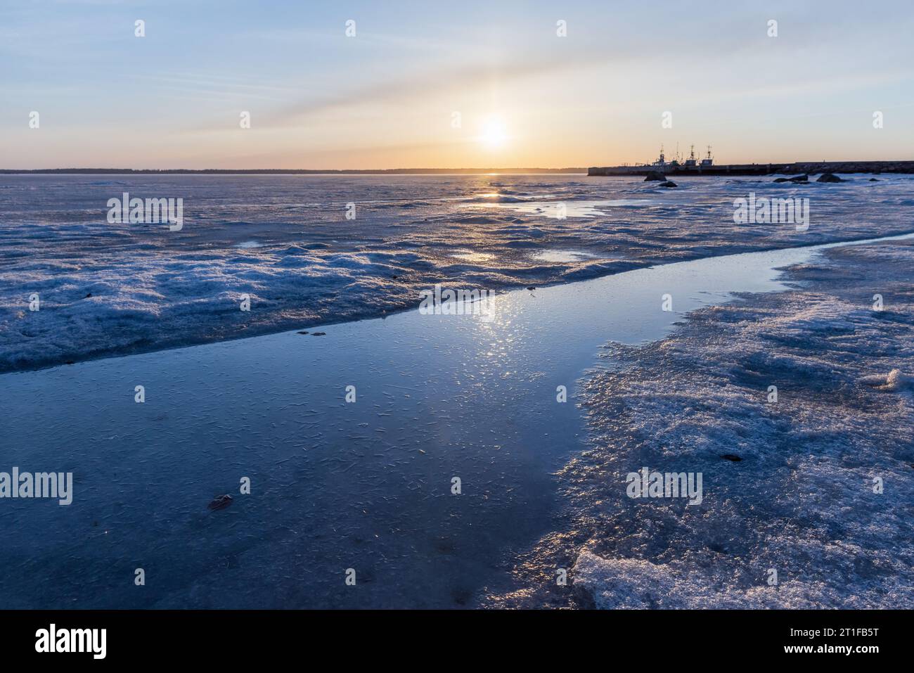 Winter landscape with frozen Baltic sea on a sunset. Natural photo ...
