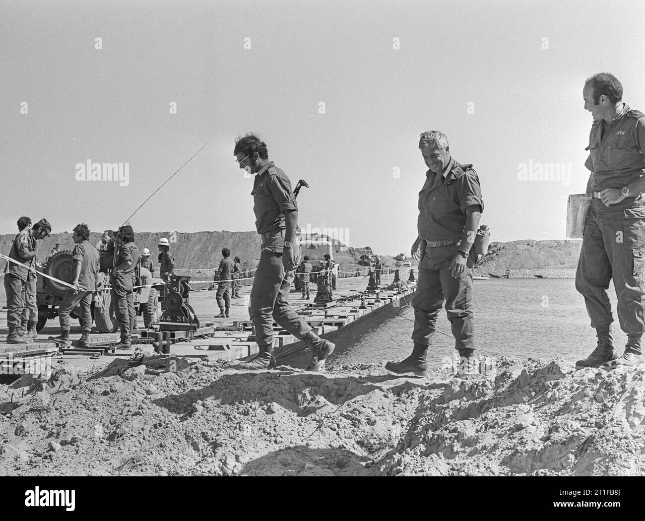 YOM KIPPUR WAR. IN THE PHOTO, ALUF ARIK SHARON NEAR A BRIDGE BUILT BY ...