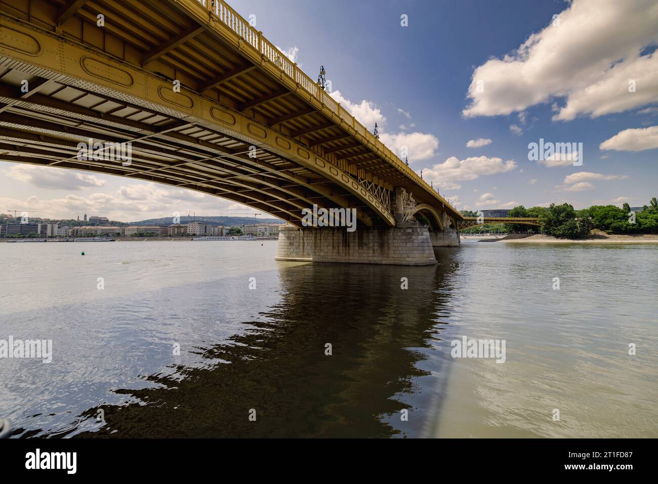 A picturesque scene of a bridge spanning a river, capturing the ...