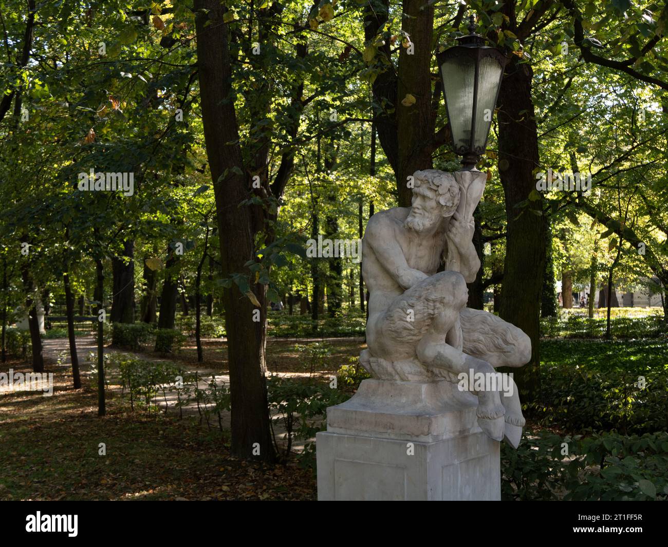 Park Sculpture Depicting Ancient Faun. Illustrative photo for a folder ...
