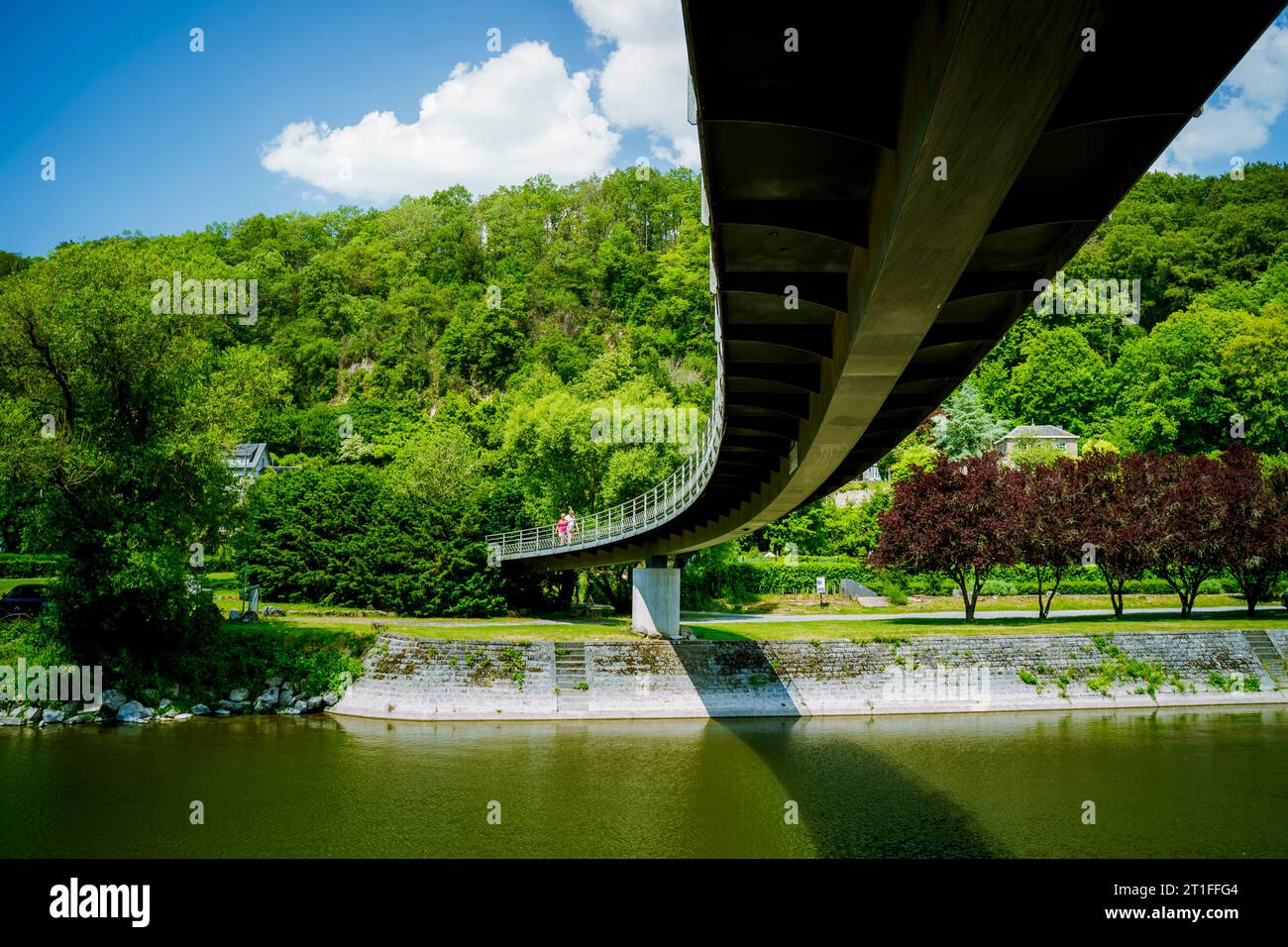 Curved architecture bridge over mountain river near village Stock Photo ...