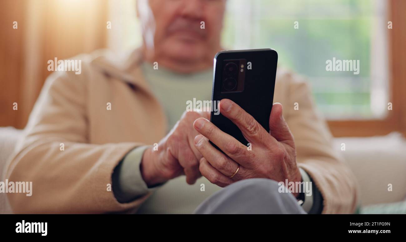 Parkinsons, smartphone and hands of senior man typing online on ...