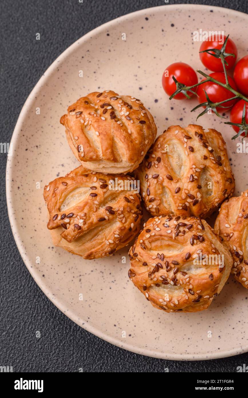 Delicious crispy mini puffs with sausage or meat with salt, thyme and ...