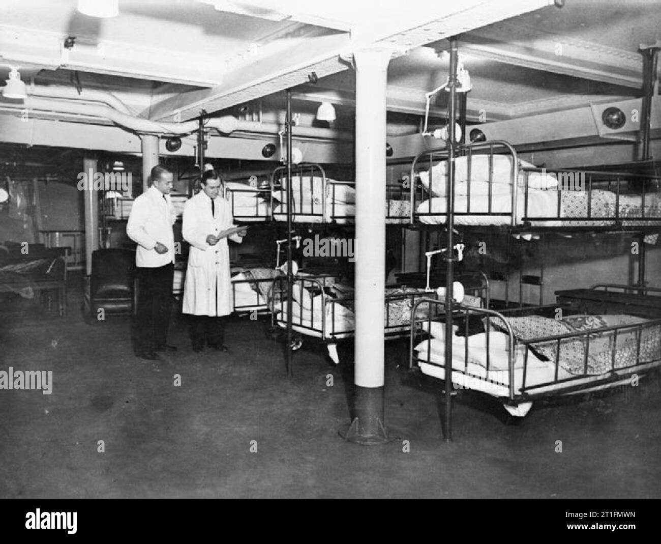 The Royal Navy during the Second World War Two doctors look at a chart ...