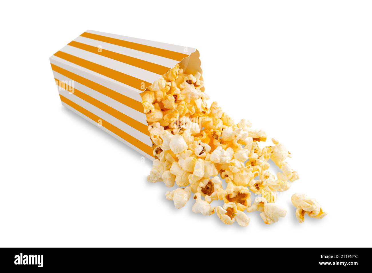 Tasty cheese popcorn falling out of a yellow striped carton bucket ...