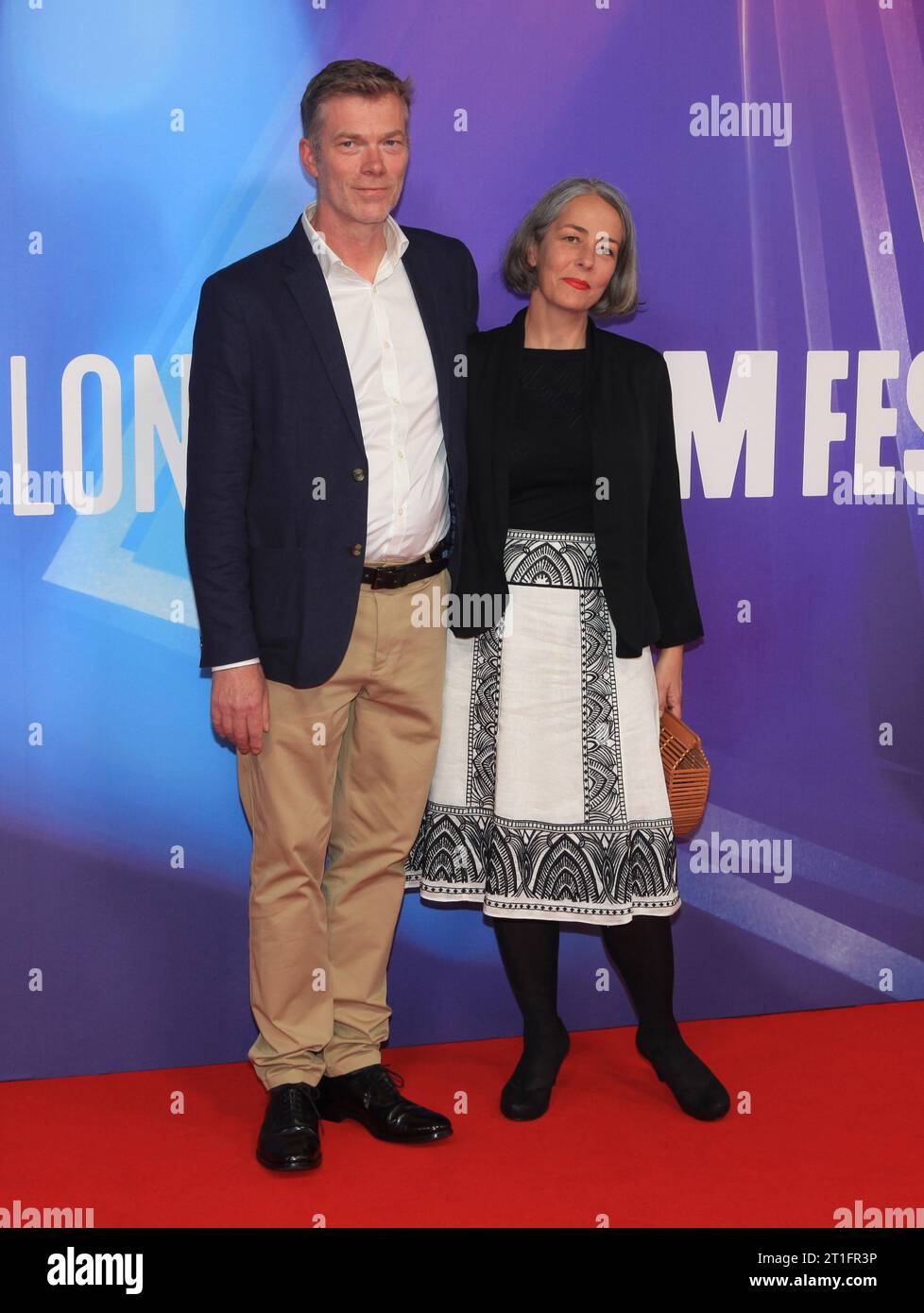 London, UK. Chris Oddy and wife at The Zone of Interest screening. 67th BFI London Film Festival ...