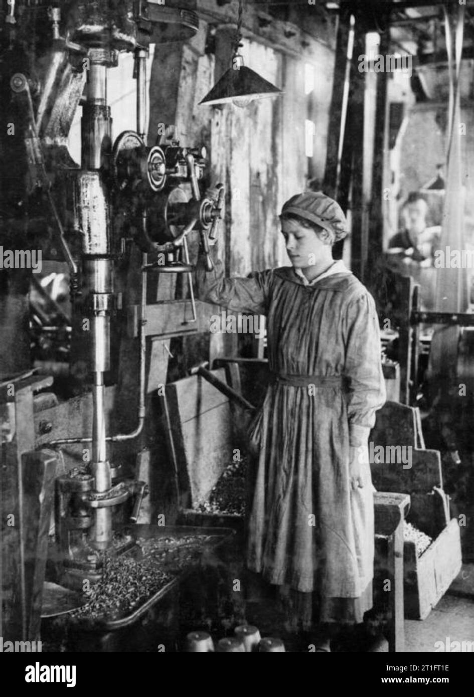 Industry during the First World War A female worker drills out high ...