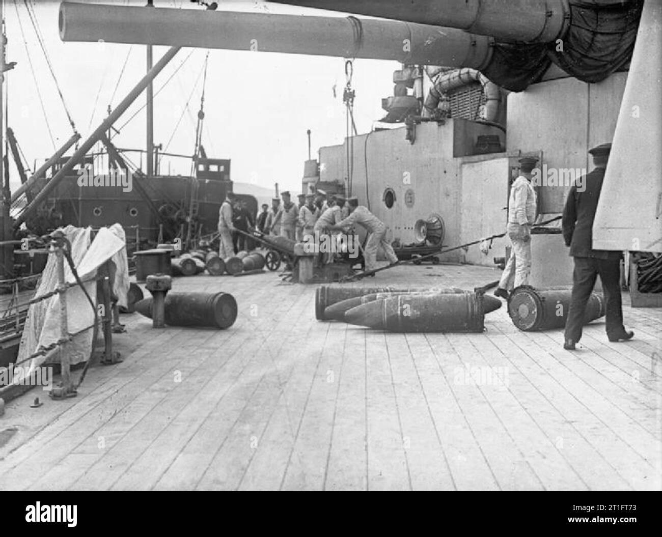 Taking shells for 13.5 inch guns aboard British battleship HMS Emperor ...