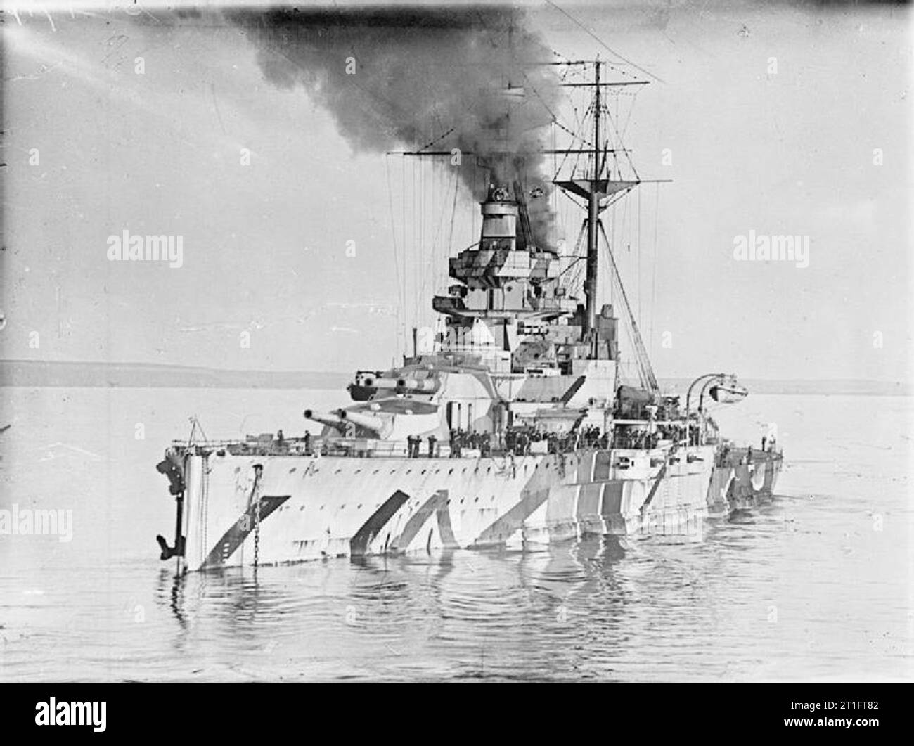 Photograph of British battleship HMS Ramillies, at anchor, in dazzle ...