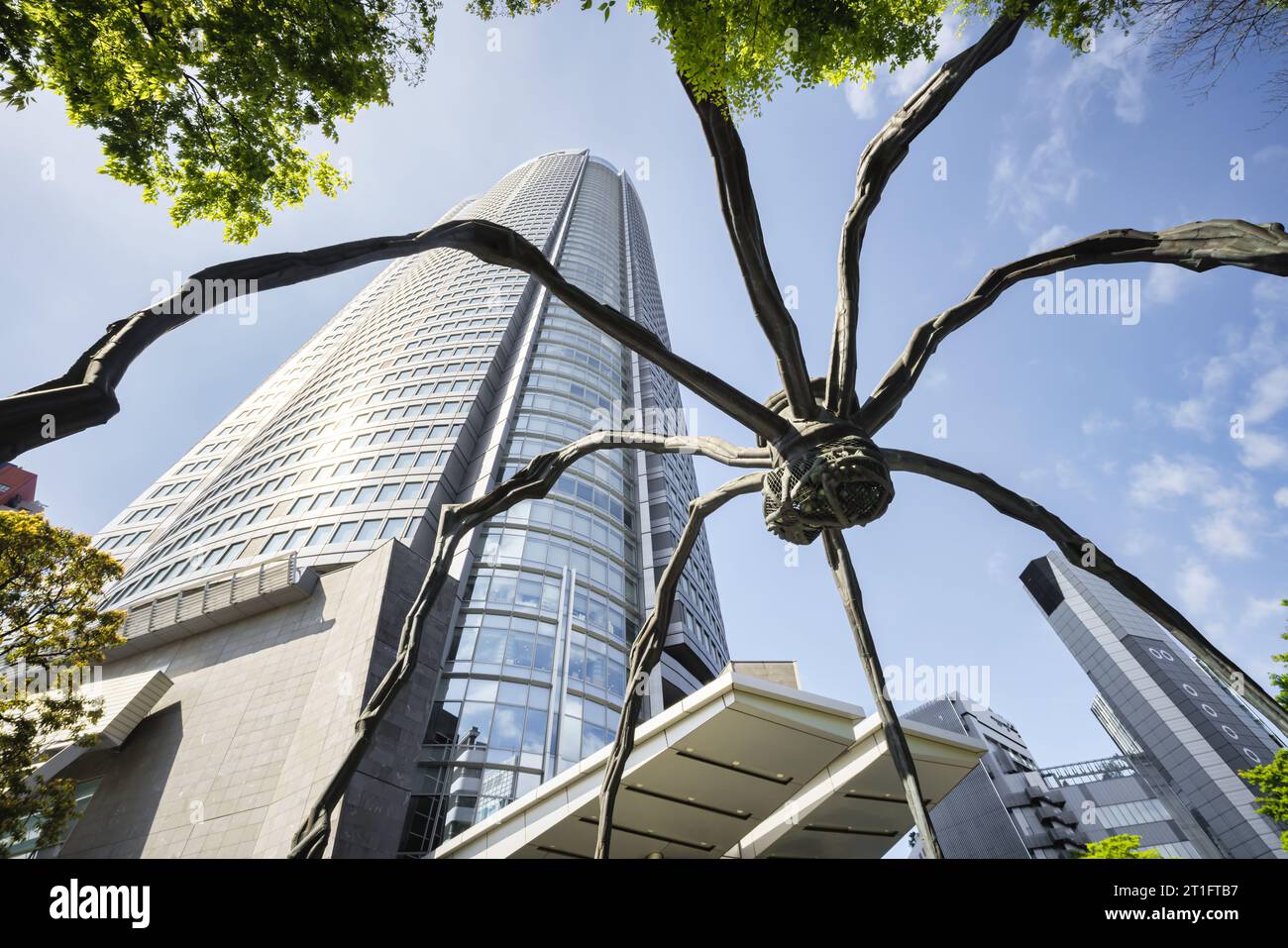 Tokyo, Japan - April 08: Roppongi Hills Mori Tower with a sulpture in ...