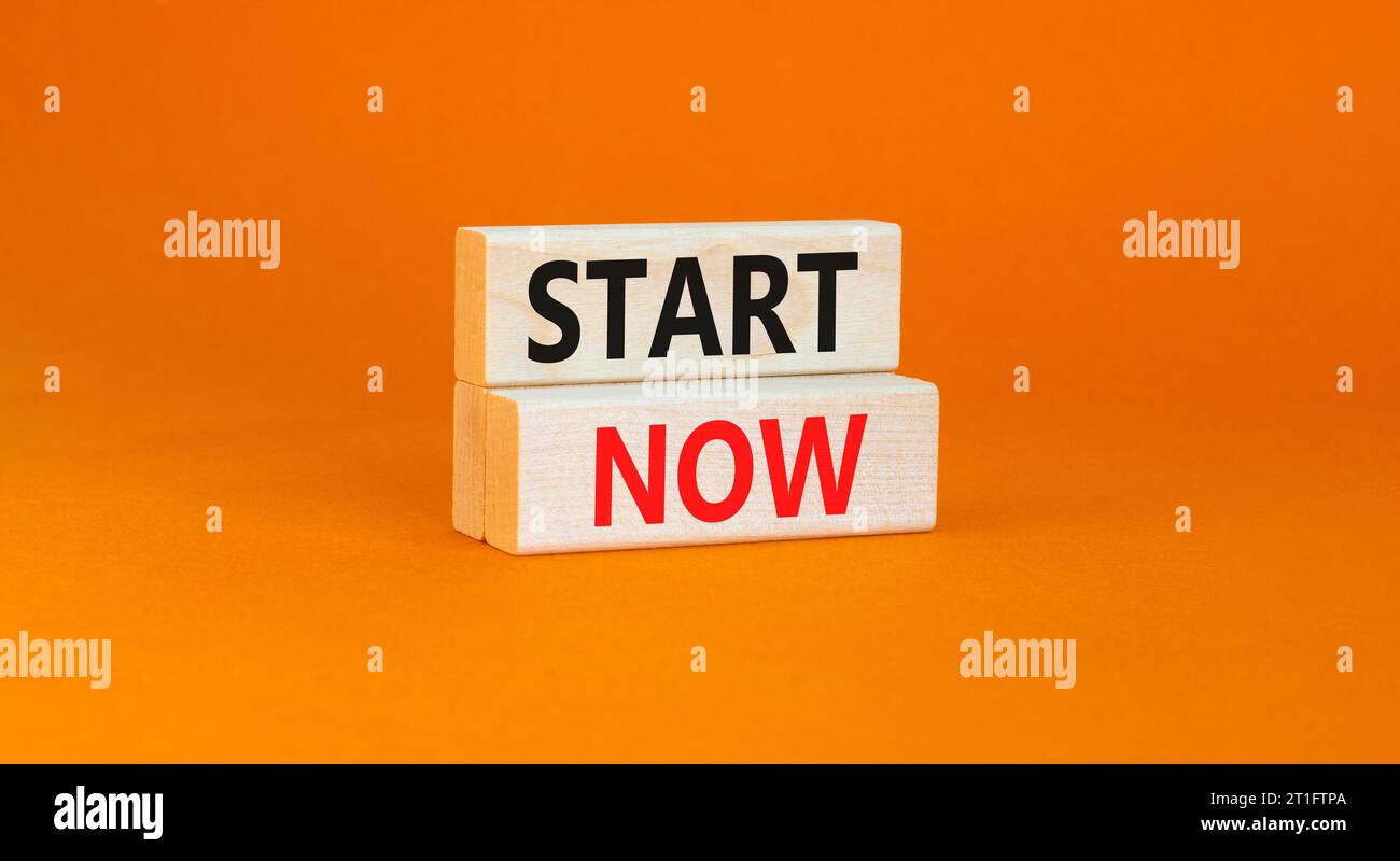 Start now symbol. Concept words Start now on beautiful wooden block ...