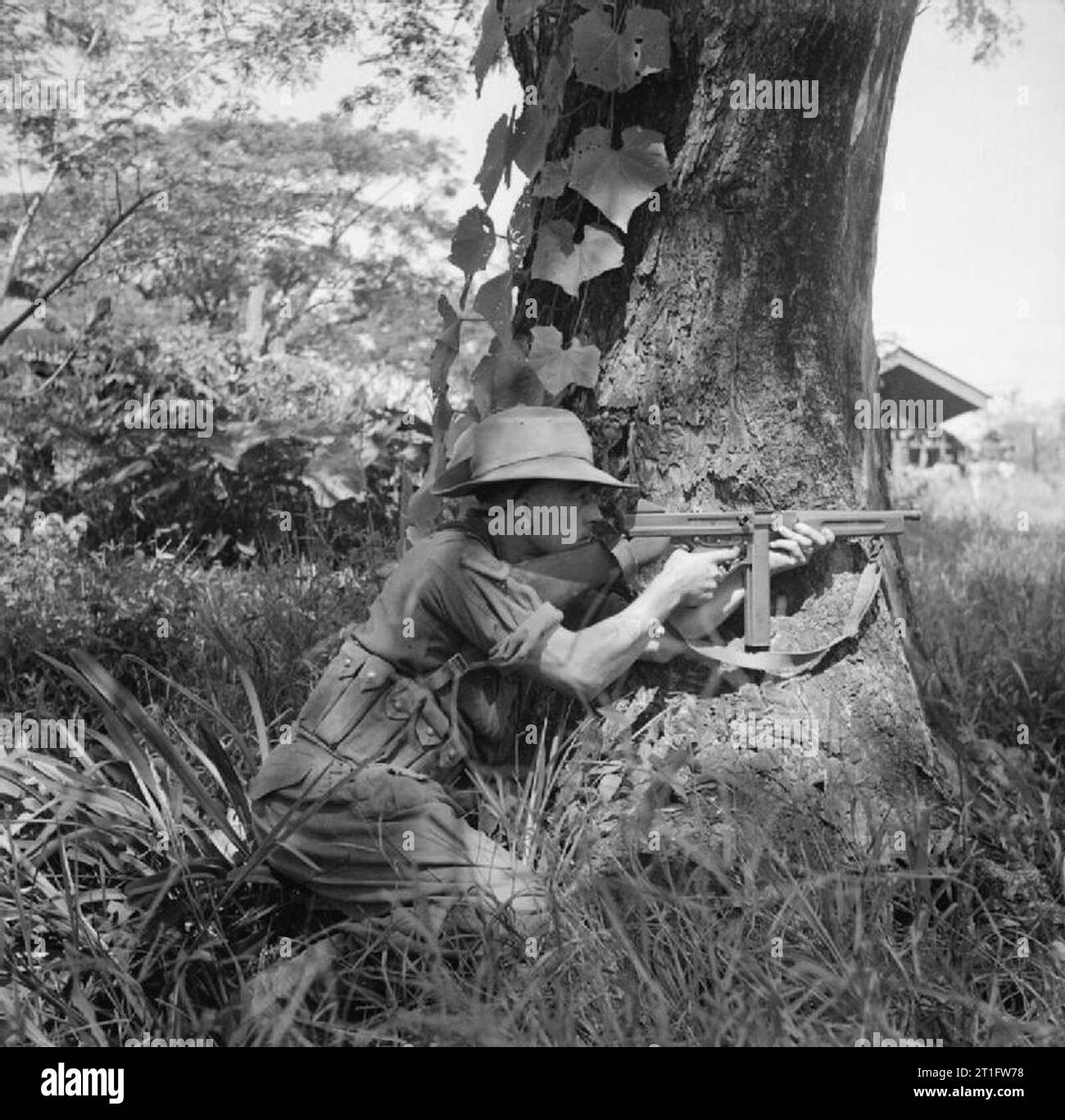 A fusilier of the Royal Scots provides covering fire with his Thompson ...