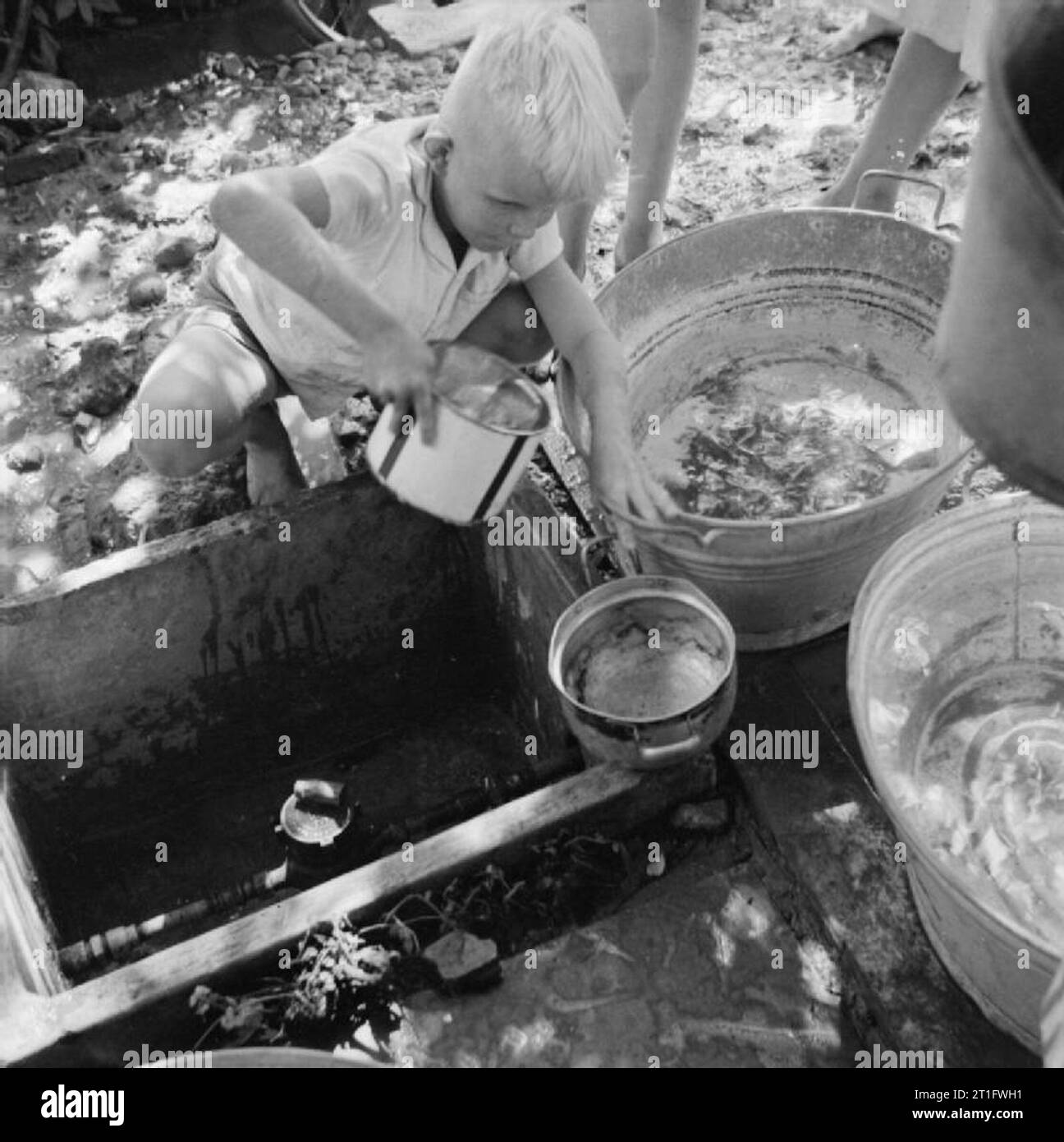 The Allied Occupation of Java, 1945 A small boy in the civilian ...