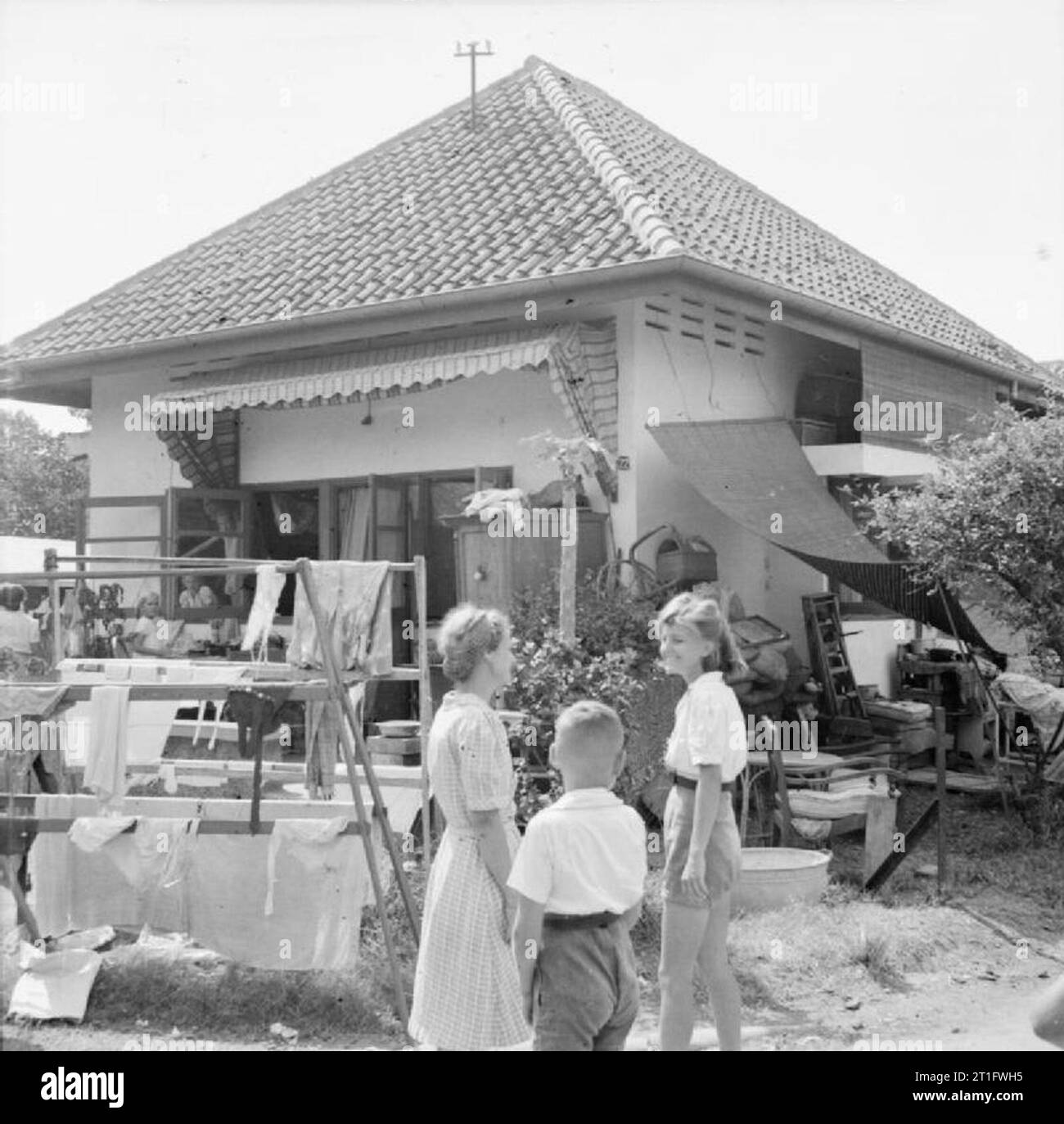 The Allied Occupation of Java, 1945 Civilian internees outside one of ...