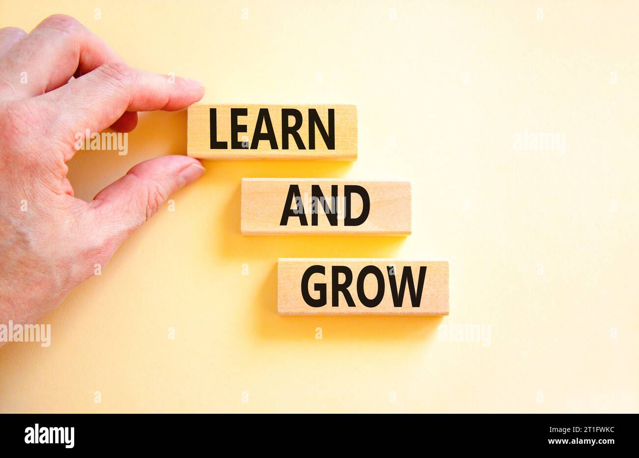 Learn and grow symbol. Concept word Learn And Grow on beautiful wooden ...