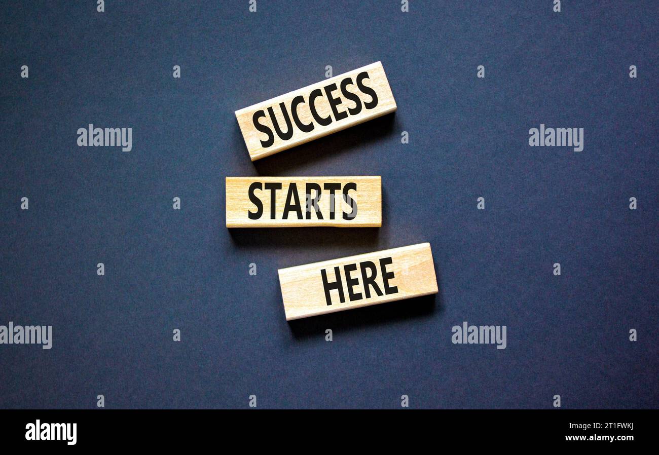 Success starts here symbol. Concept word Success starts here on beautiful wooden block ...