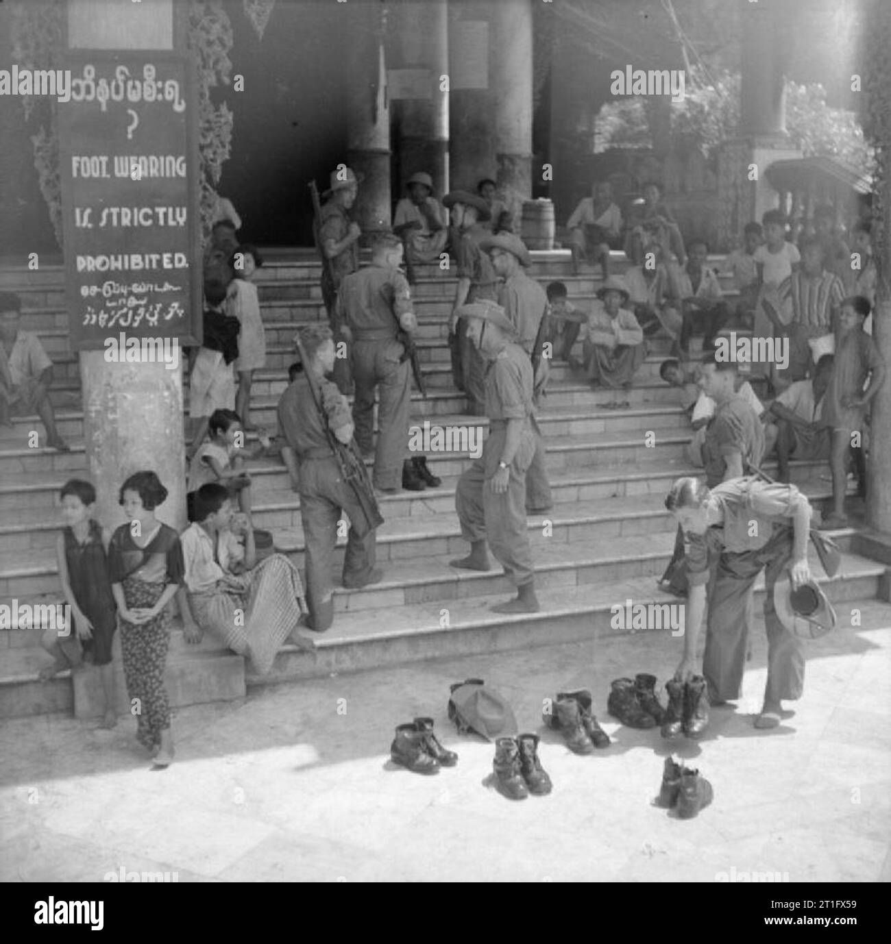 The British Army in Burma 1945 Soldiers remove their shoes while they ...