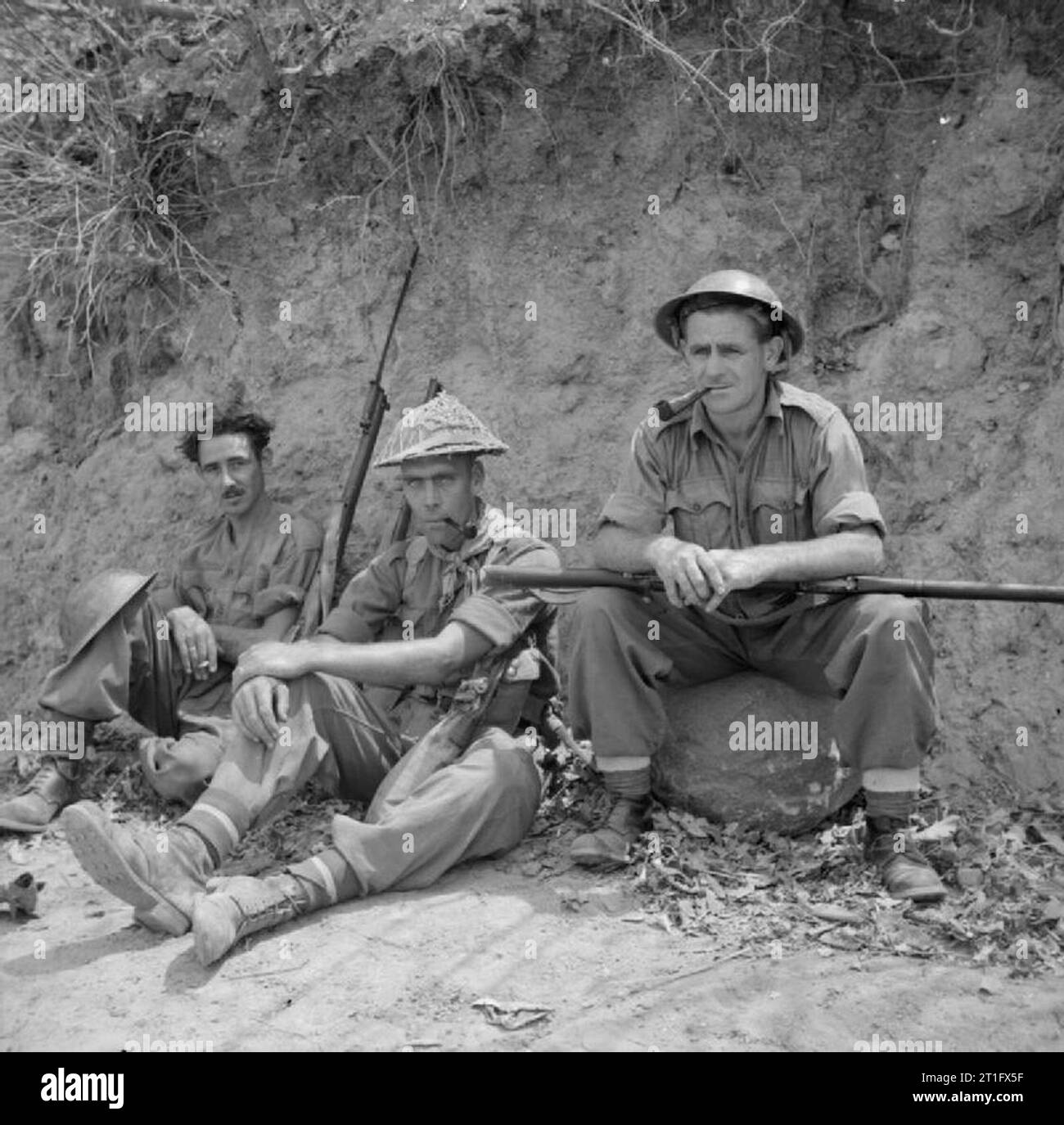 The British Army in Burma 1945 Infantrymen enjoy a brief rest at the foot of Mount Popa as they ...