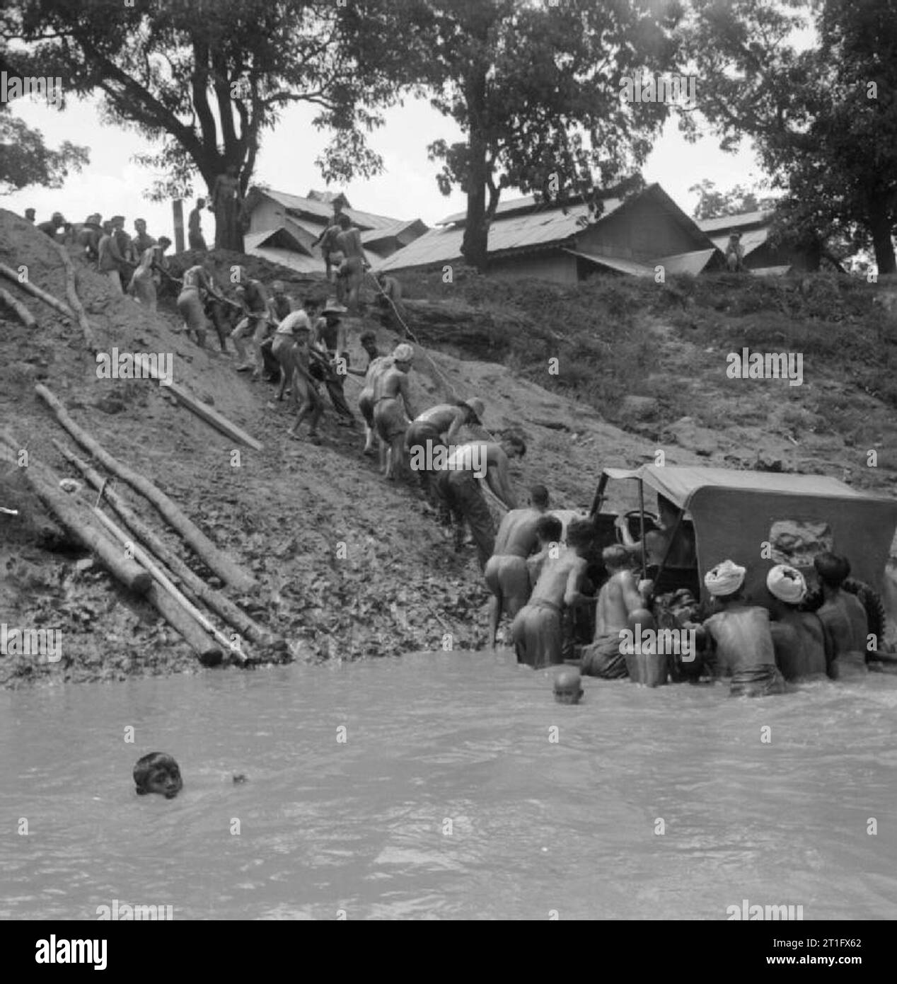 The British Army in Burma 1945 Burmese villagers help extricate a jeep ...