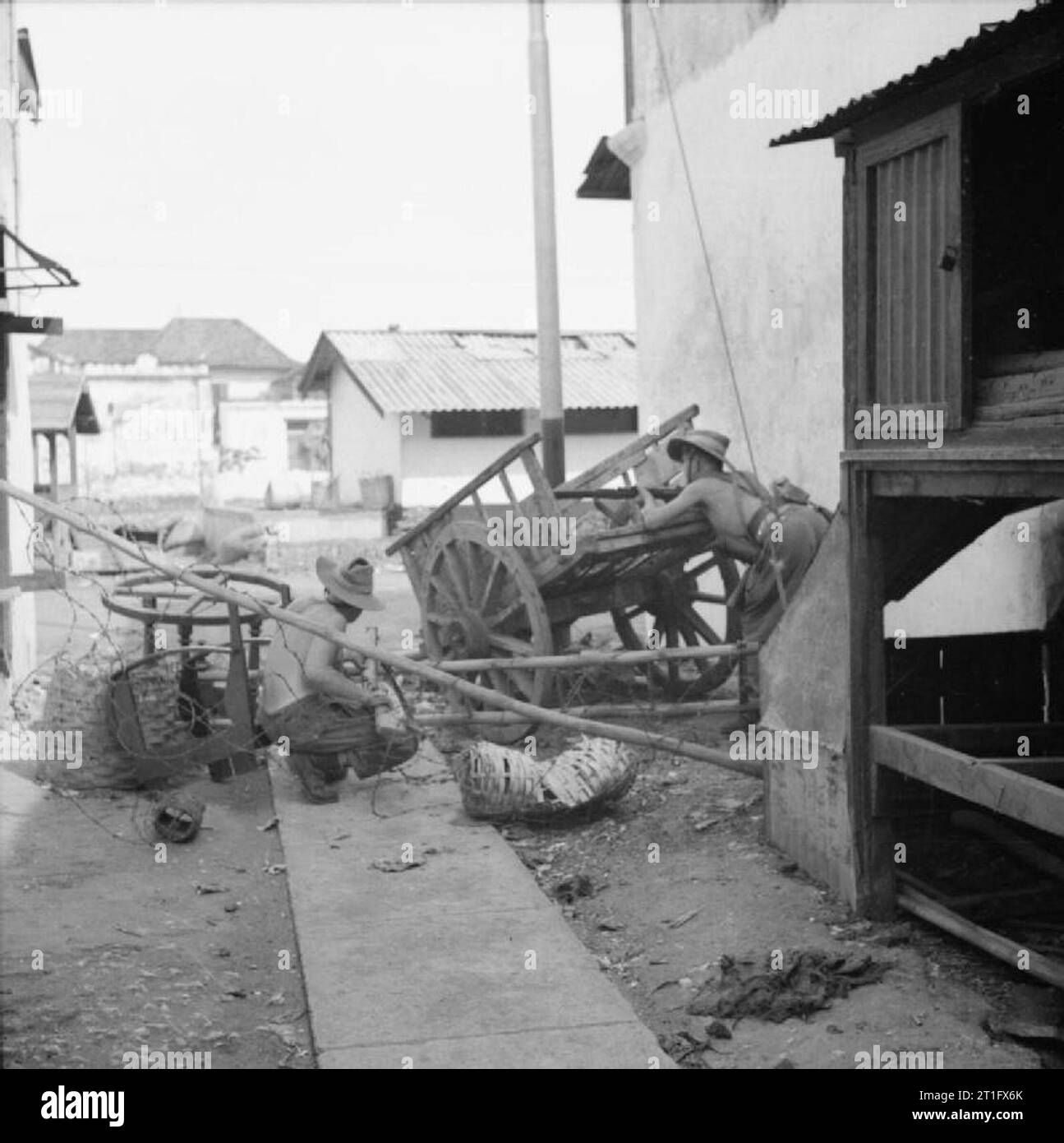 The British Occupation of Java Two British infantrymen take cover in a ...