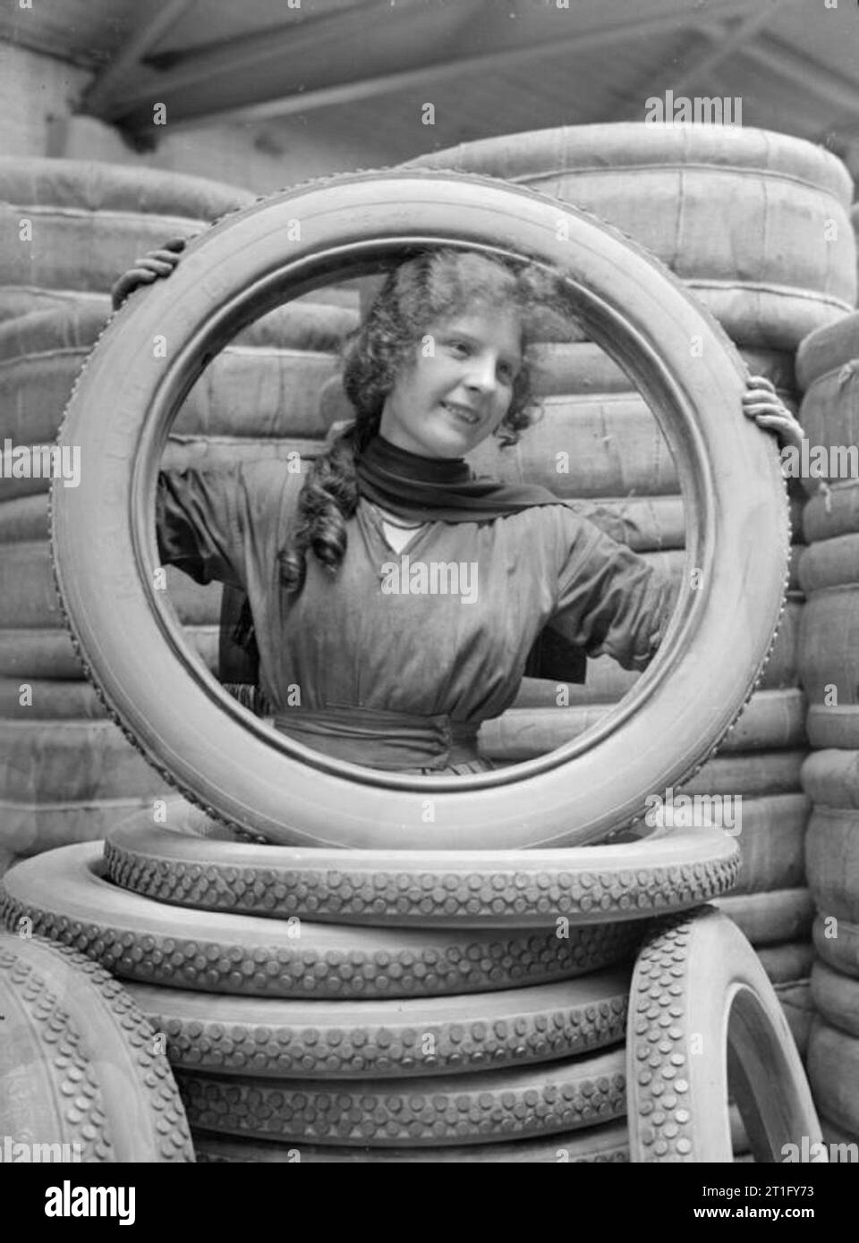 Industry during the First World War A female worker poses with a stack ...