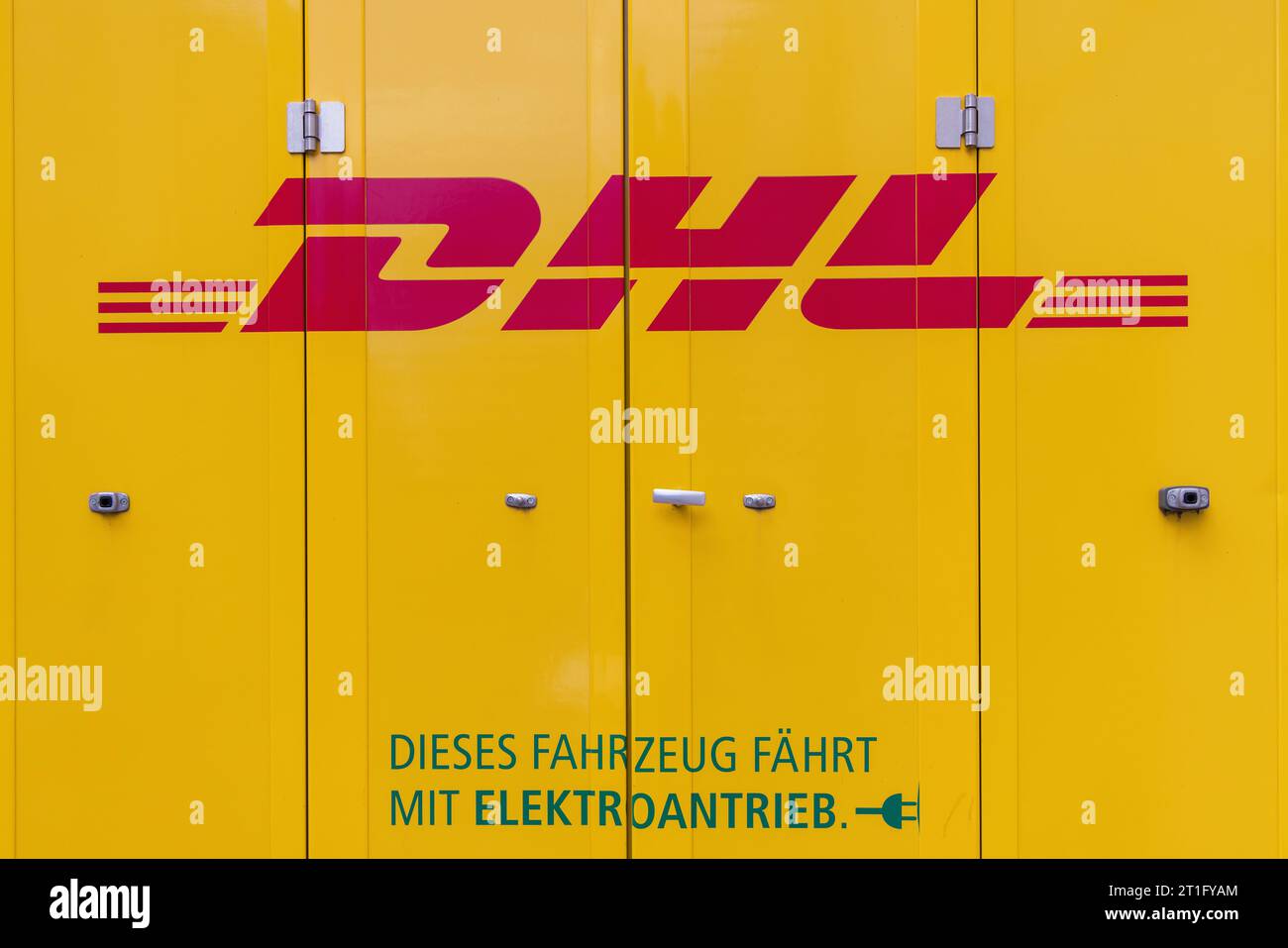 Munich, Germany - April 05, 2023: Logo of the DHL company on a yellow ...