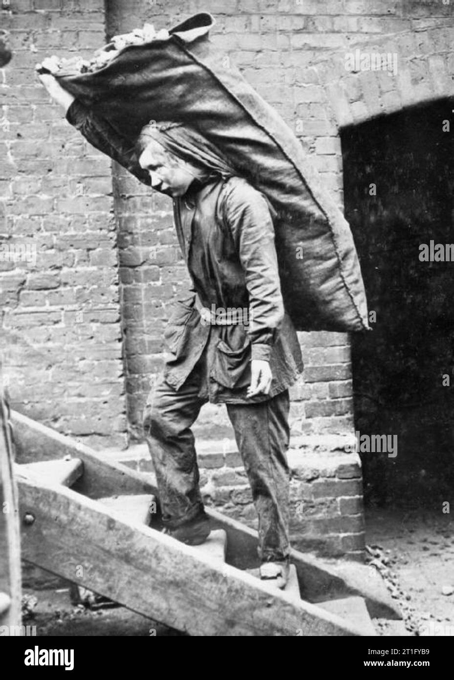 Industry during the First World War A female worker carries a sack of ...