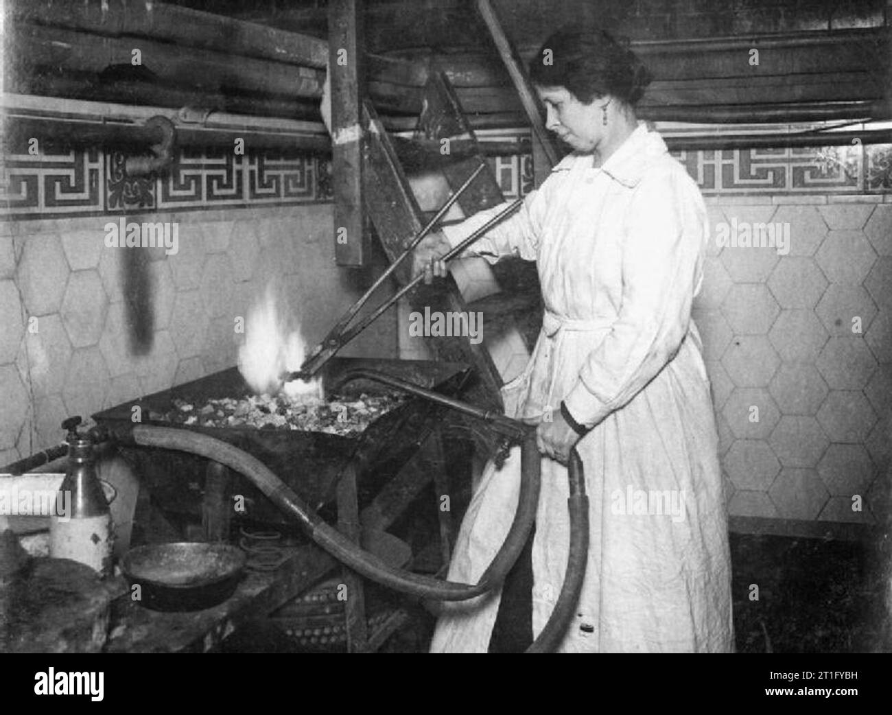 Industry during the First World War A female worker brazing metal tools ...