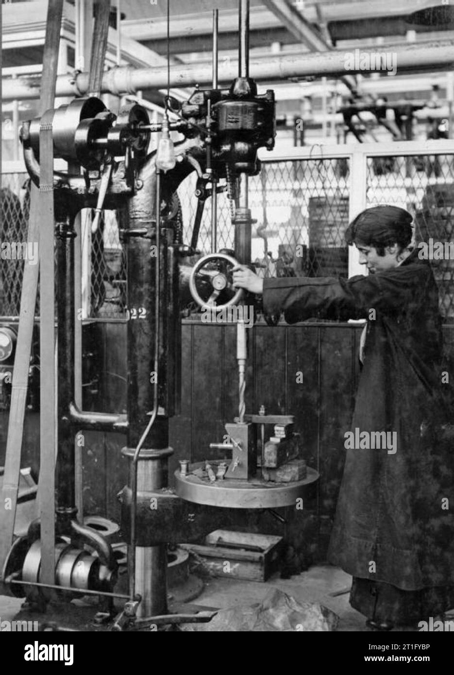 Industry during the First World War A female worker operates a drilling ...