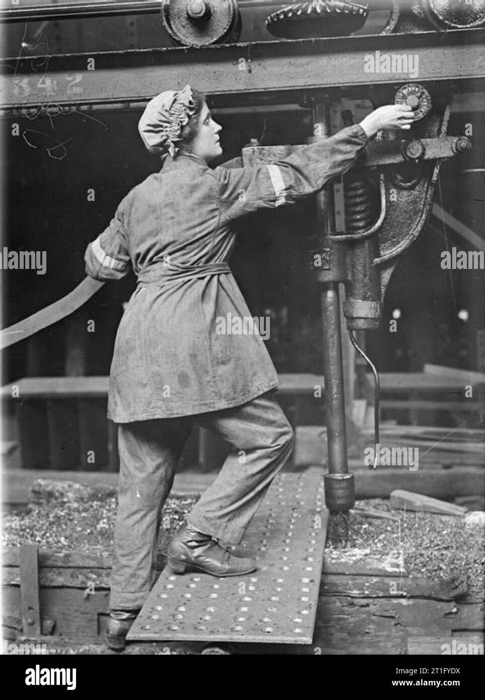 Shipbuilding during the First World War A female worker adjusts a piece ...