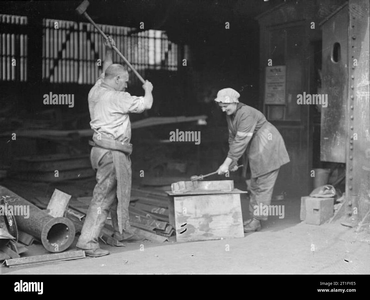 Shipbuilding during the First World War A female worker assists a ...