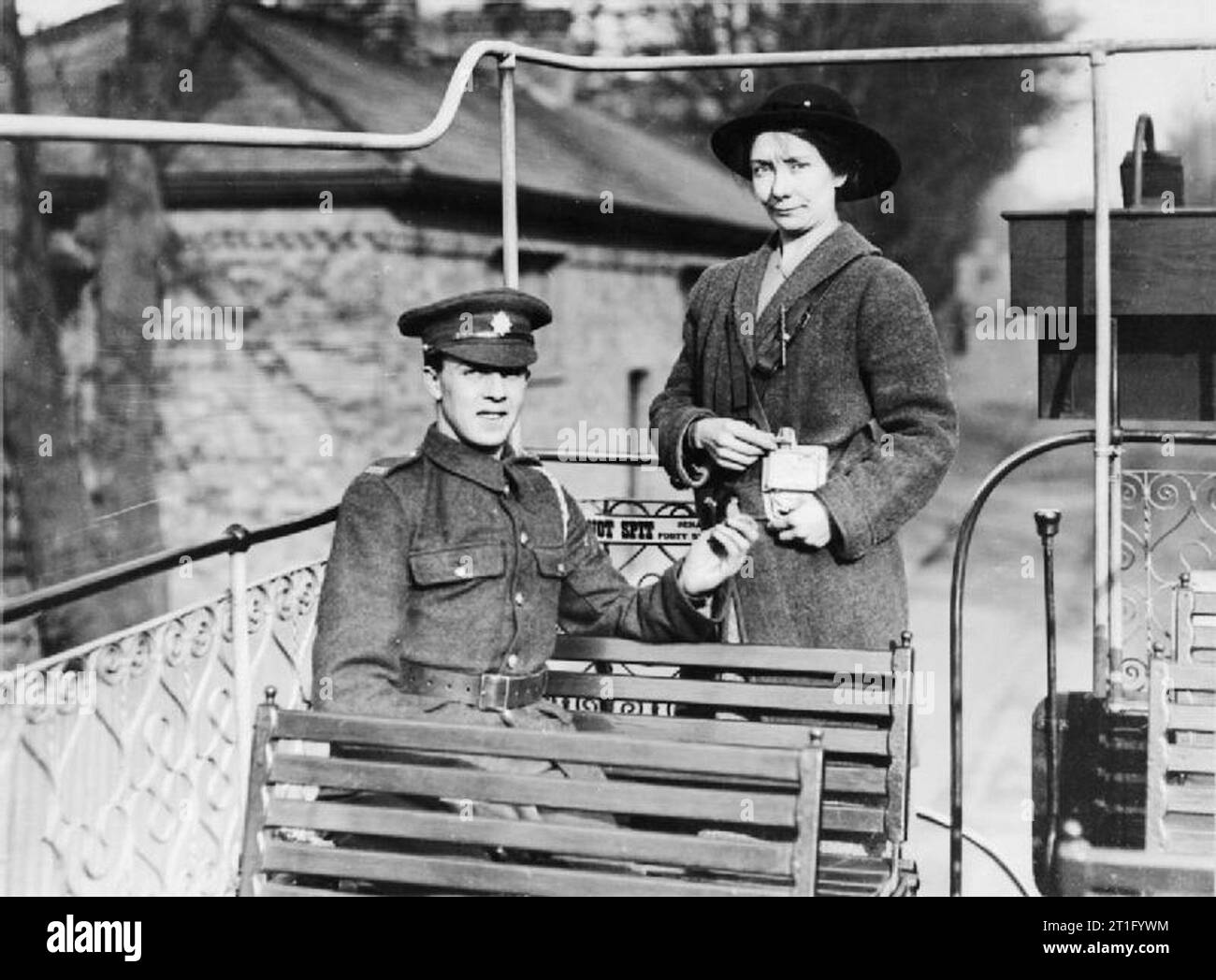 Women in the First World War A woman tram conductor issues a ticket to ...